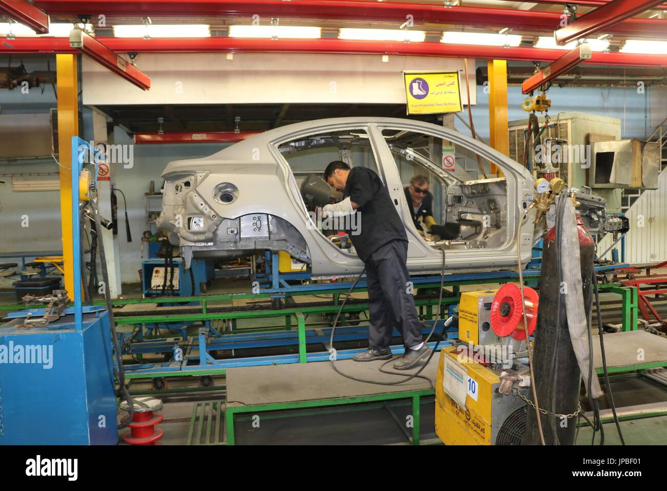 Iranian automaker Bahman Group assembles Mazda 3 passenger cars at its ...