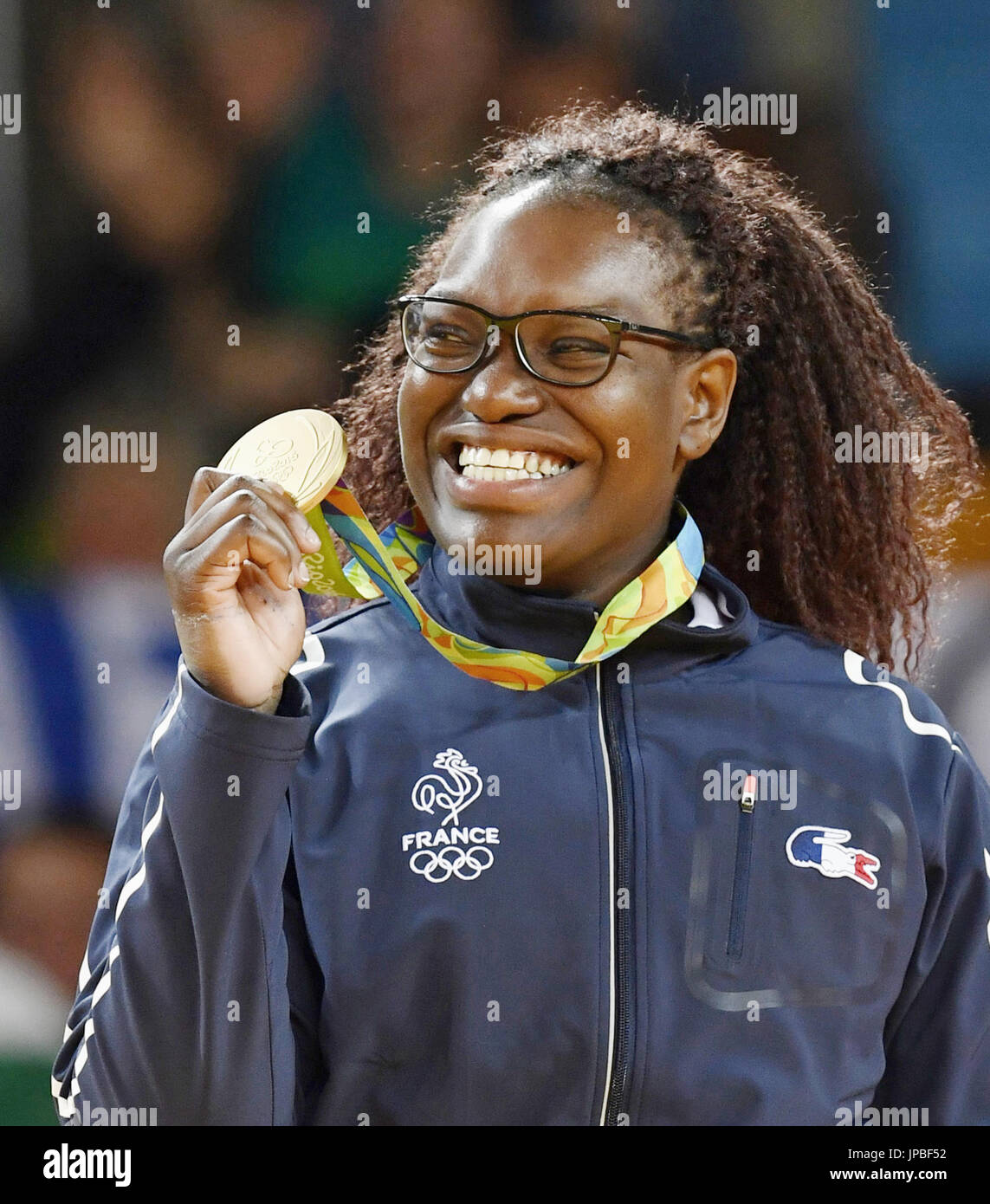 French judoka Emilie Andeol poses with her gold medal of the women's ...
