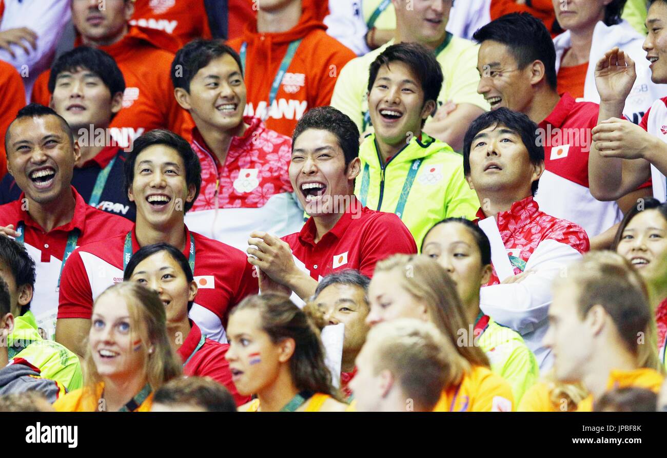 Japanese swimmers cheer for their compatriots at the Olympic Aquatics ...