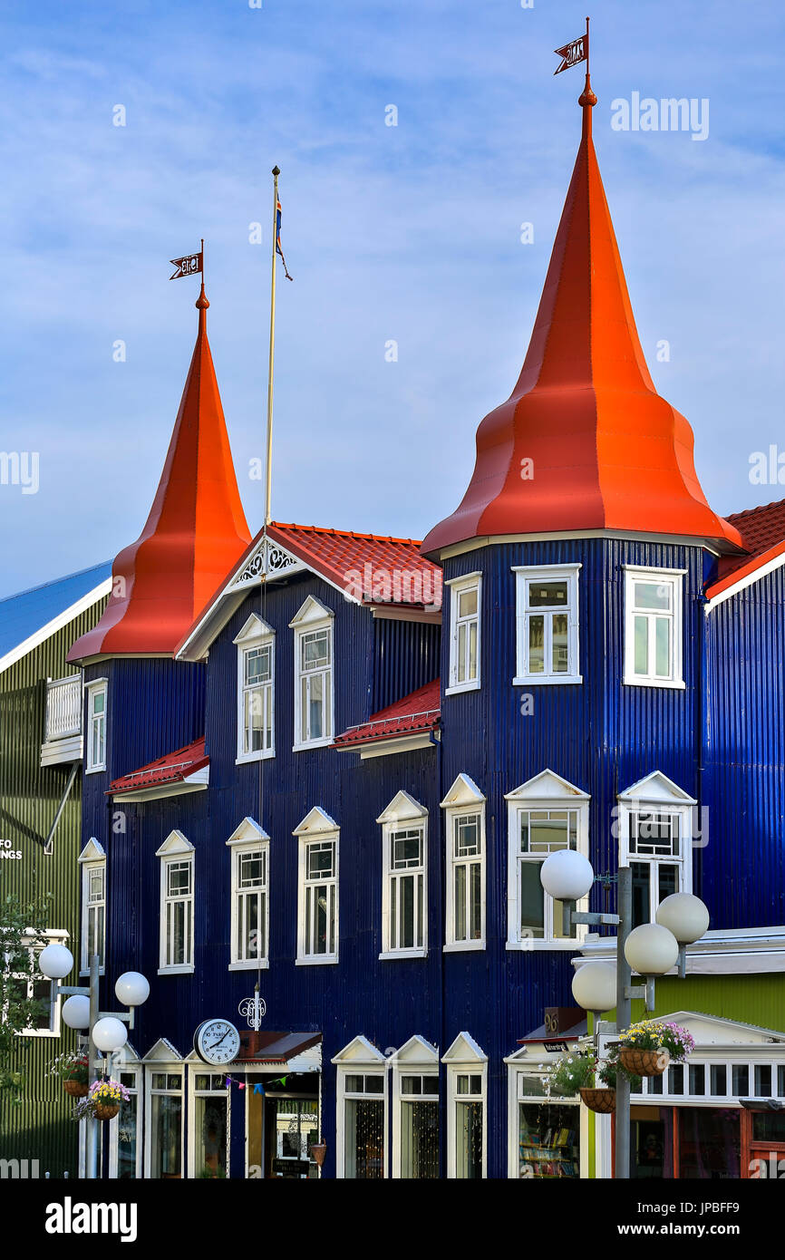 Red flags blue building hi-res stock photography and images - Alamy