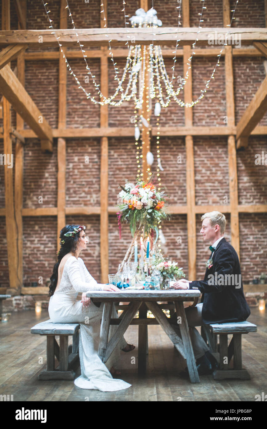 Bride and groom at wedding celebration in barn Stock Photo - Alamy