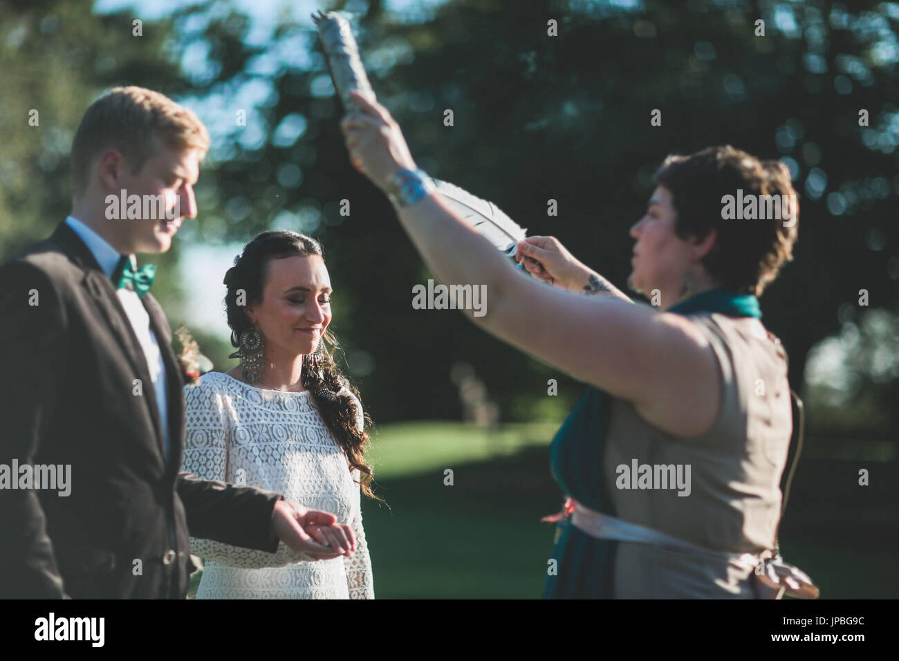 Alternate bridal couple at spiritual wedding ceremony outdoors Stock ...