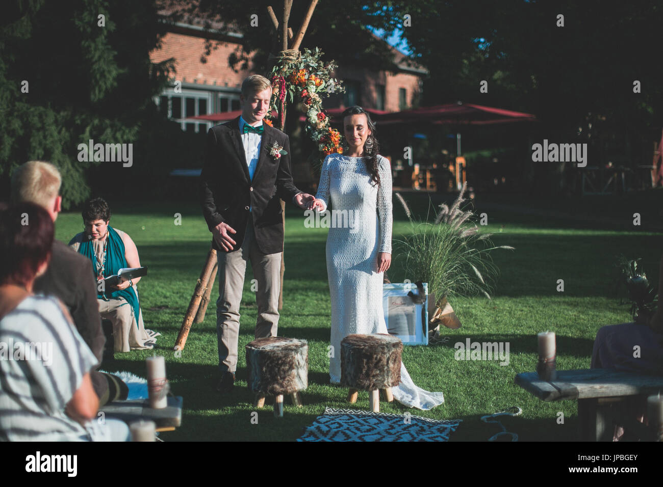 Alternate bridal couple at spiritual wedding ceremony outdoors Stock ...