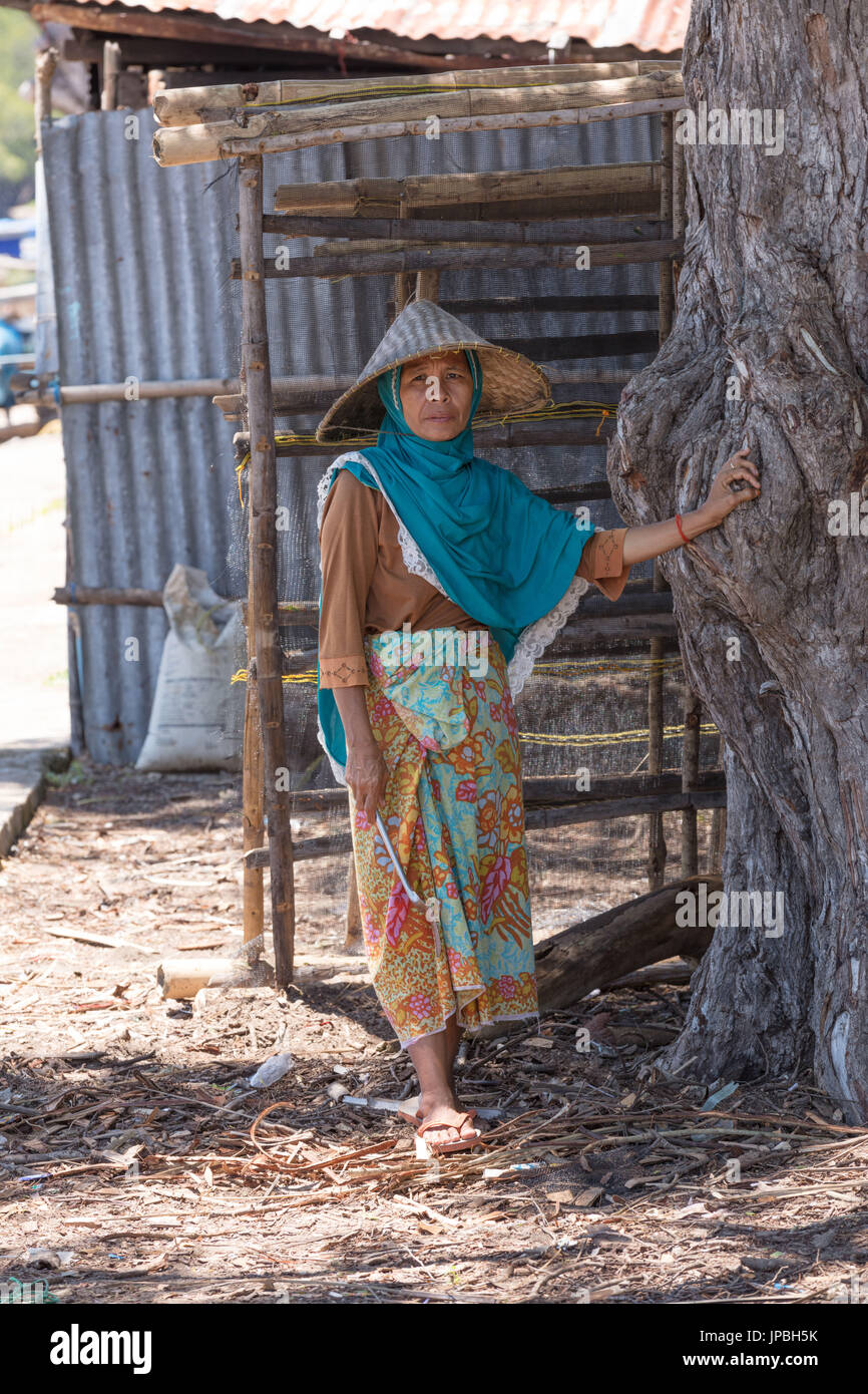 Asian woman portrait after work, Indonesia, Pulau Rinca, traditional ...
