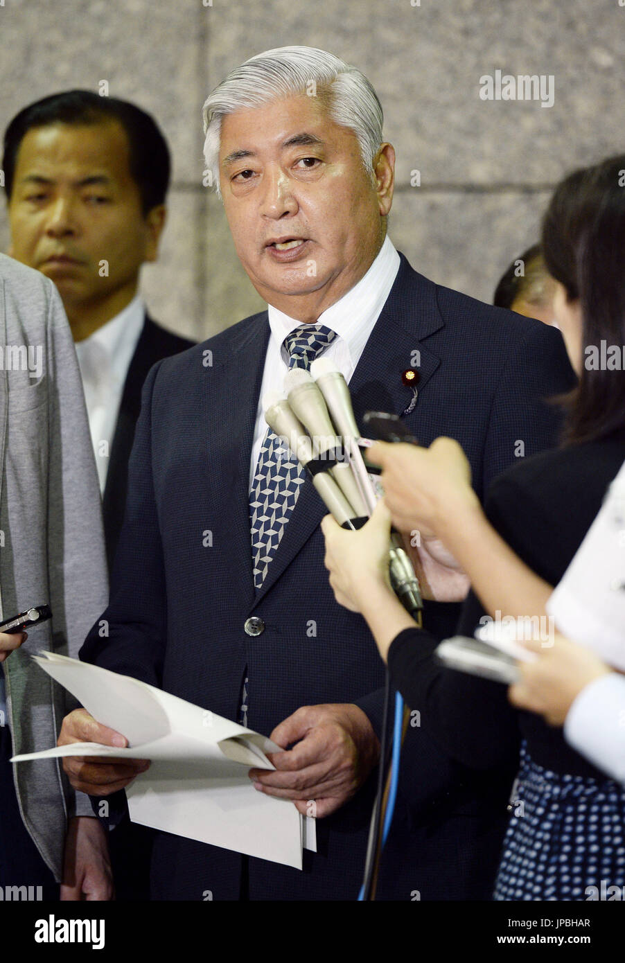 Japanese Defense Minister Gen Nakatani speaks to reporters at the ...