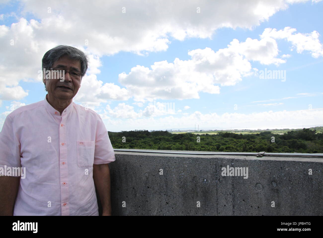 Michio Sakima, director of Sakima Art Museum, stands on the rooftop of ...