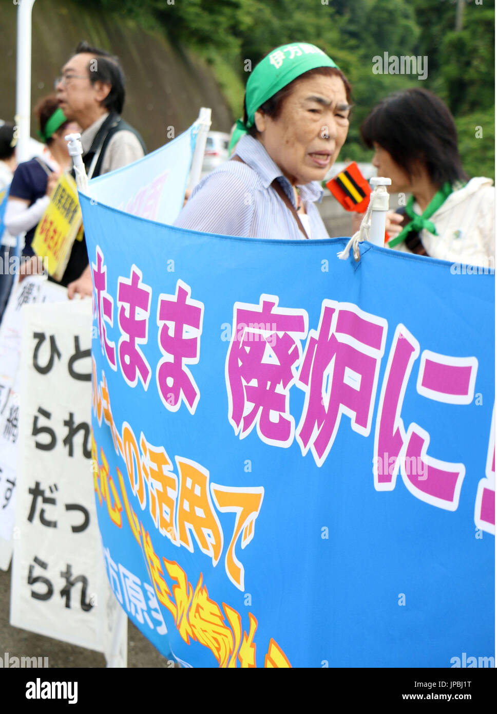 People stage a rally in front of Shikoku Electric Power Co.'s Ikata ...