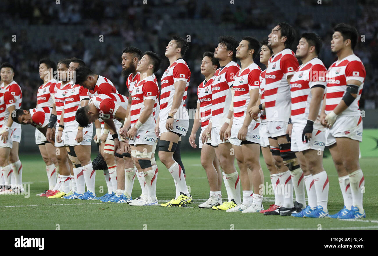 Members of the Japanese men's rugby team look disappointed following ...