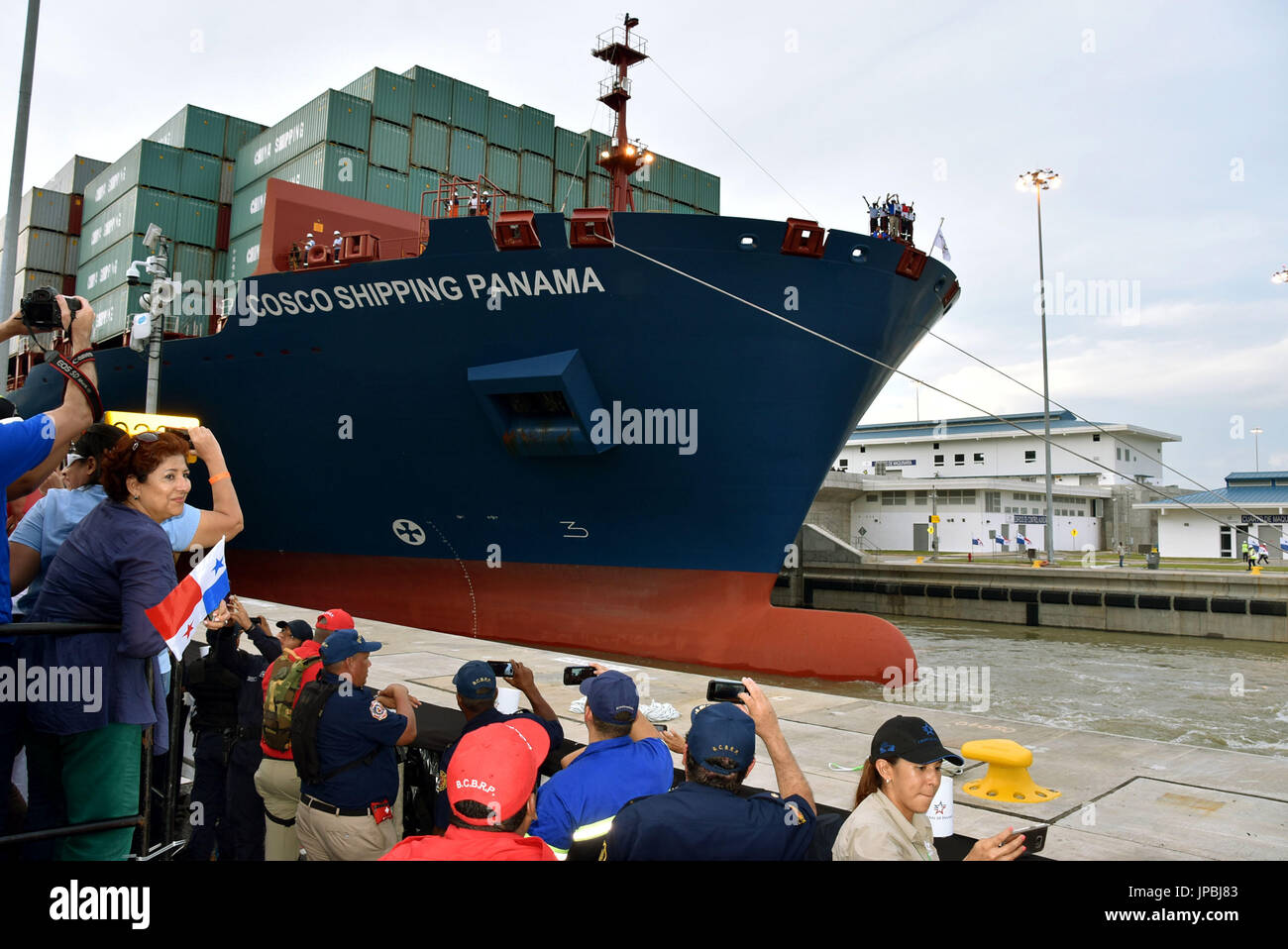 Spectators take pictures as the Chinese container ship Cosco Shipping ...
