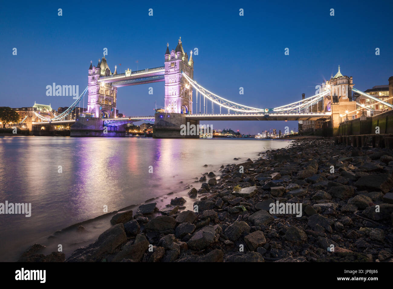 Night view of the Tower Bridge reflected in river Thames London United ...