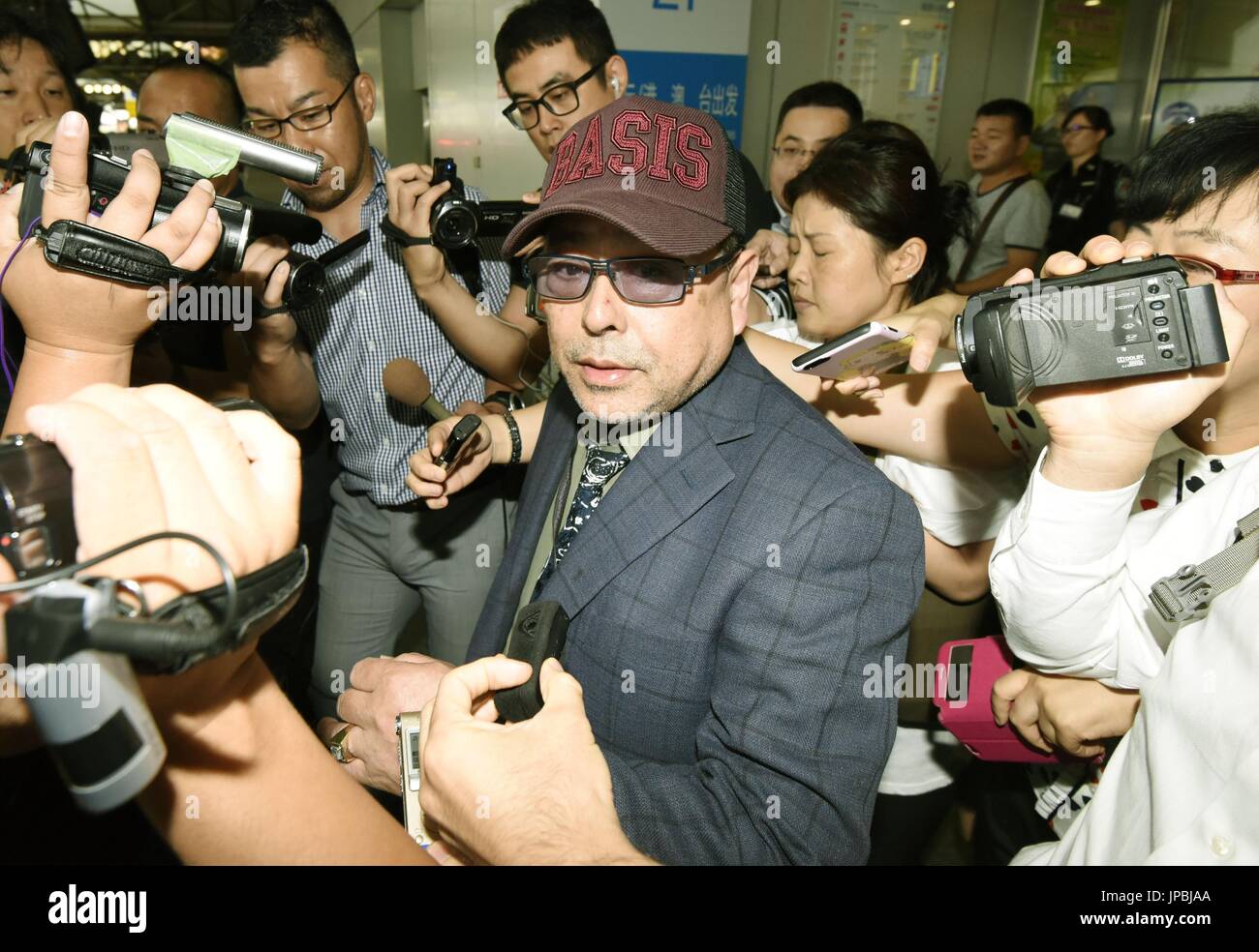 A Japanese sushi chef, known by the alias Kenji Fujimoto, is surrounded ...