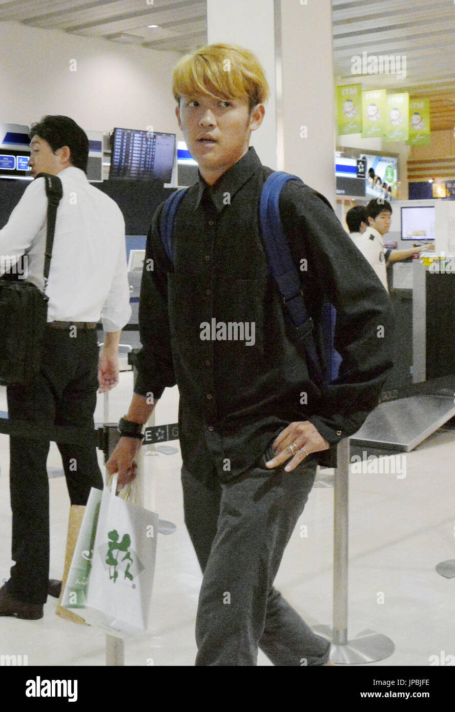 Japanese striker Takashi Usami leaves Osaka International Airport for ...