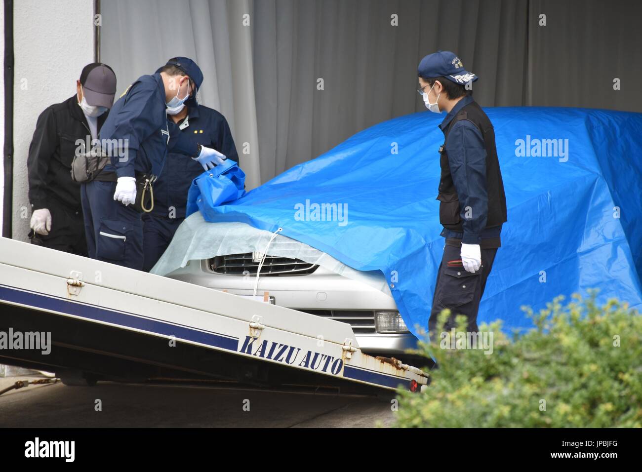 A sedan is transported to the Kaizu Police Station in the central Japan ...