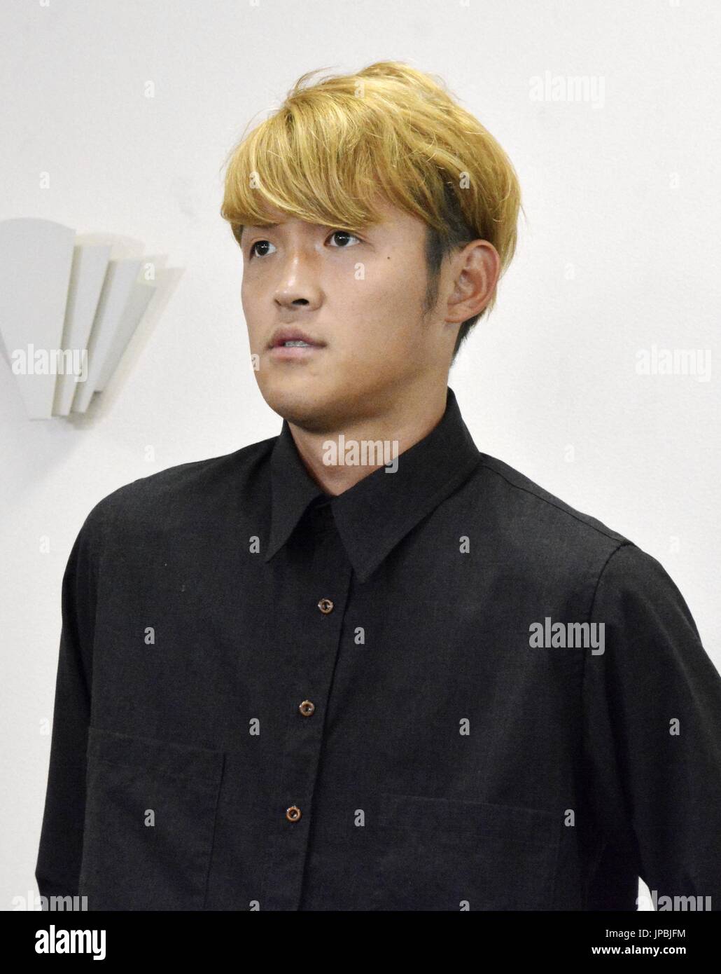 Japanese striker Takashi Usami leaves Osaka International Airport for ...