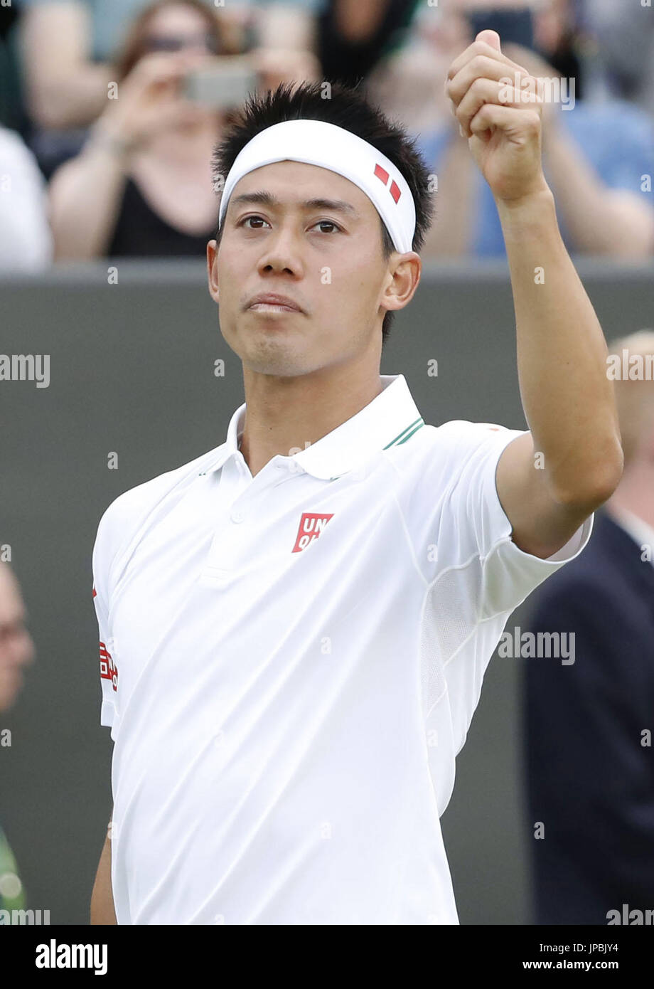 Kei Nishikori of Japan acknowledges the crowd after beating Andrey ...