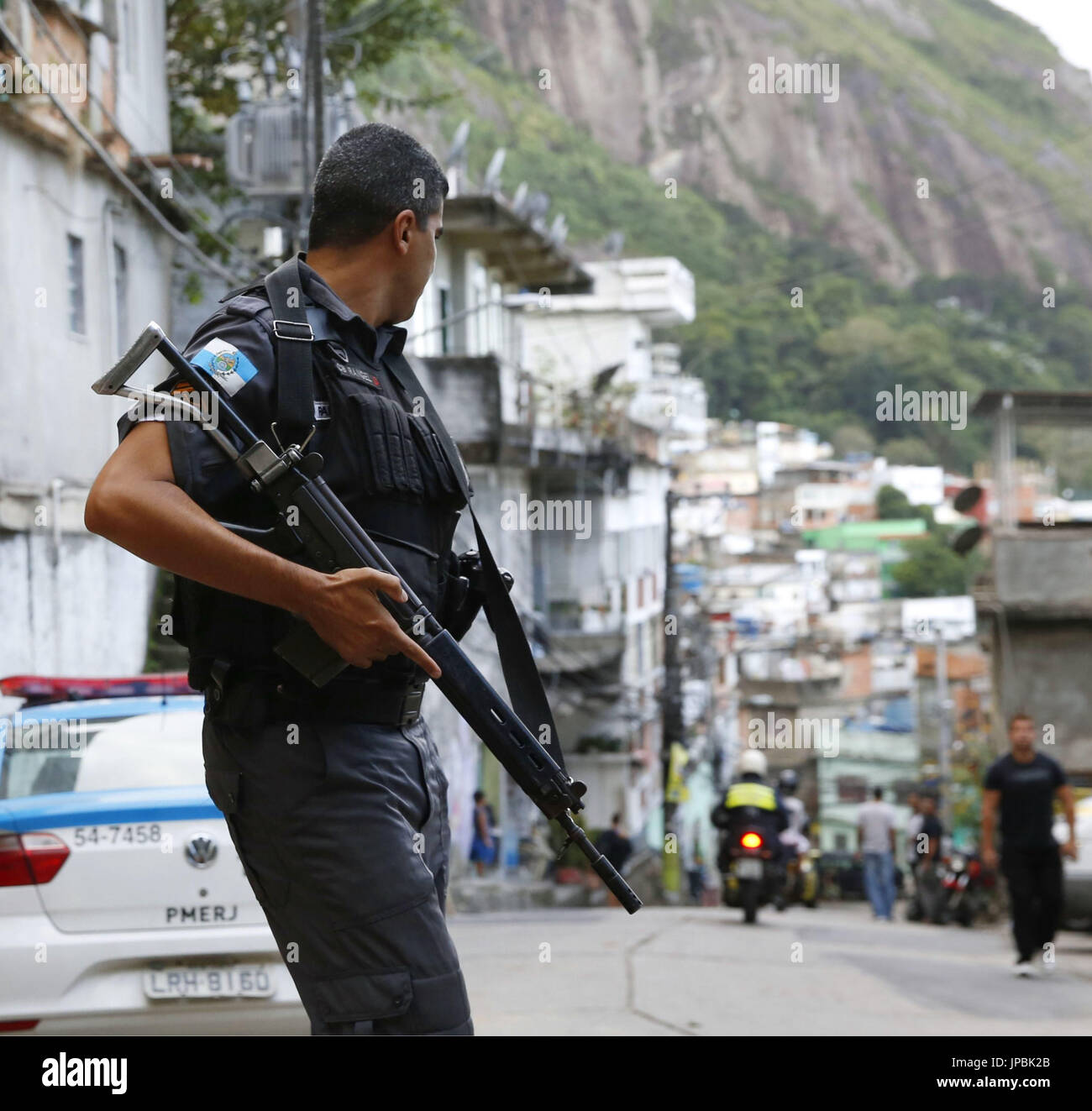 Photo taken May 25, 2016, shows an armed police officer standing guard ...