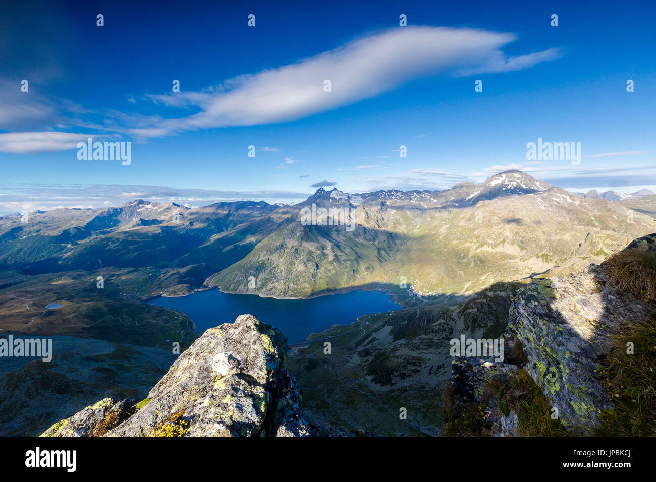 Top view of Lake Montespluga framed by the rocky peaks Ferrè and Tambò ...