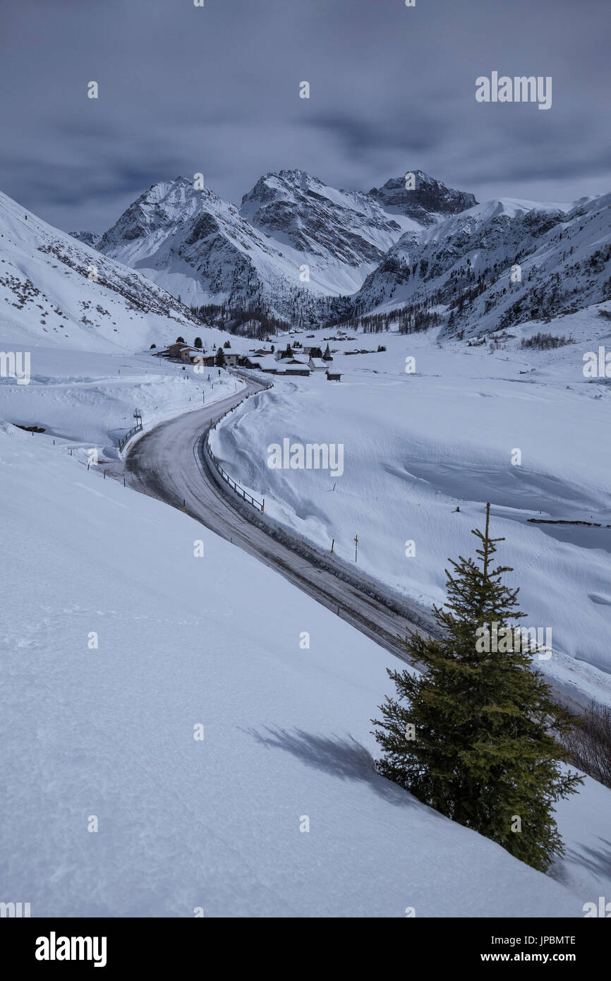 View of the Walser village of Sertig Dorfli during a full moon night ...
