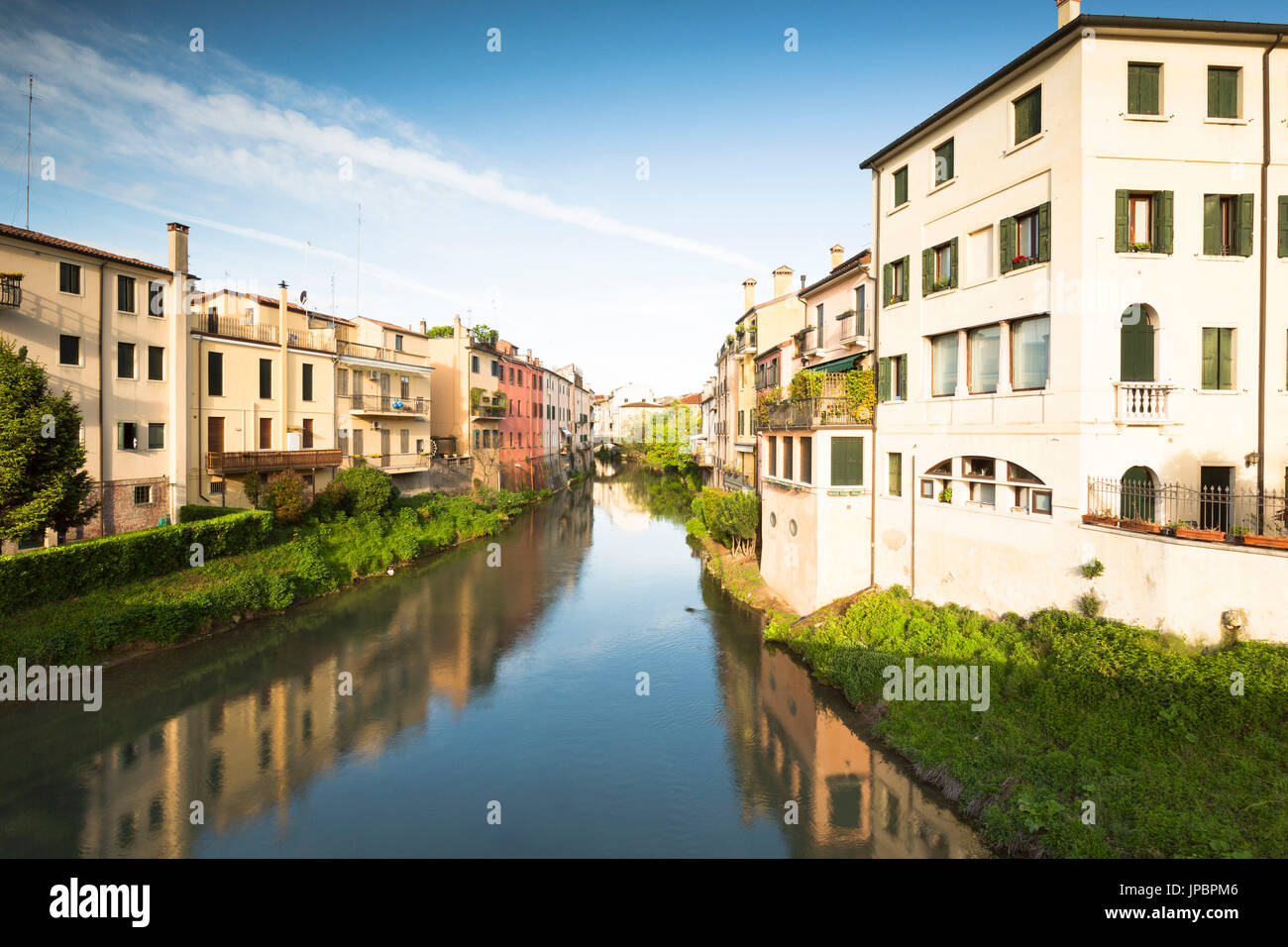 a view of one of the typical canals in the centre of Padua with ...