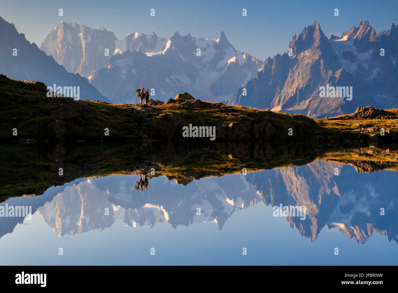 Two hikers on the Cheserys's lake, chamonix, france, europe Stock Photo ...