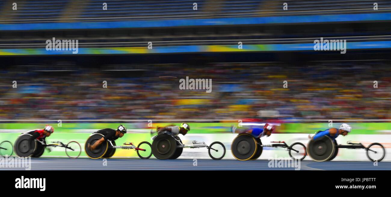 Wheelchair athletes engage in a high-speed race in the athletics ...