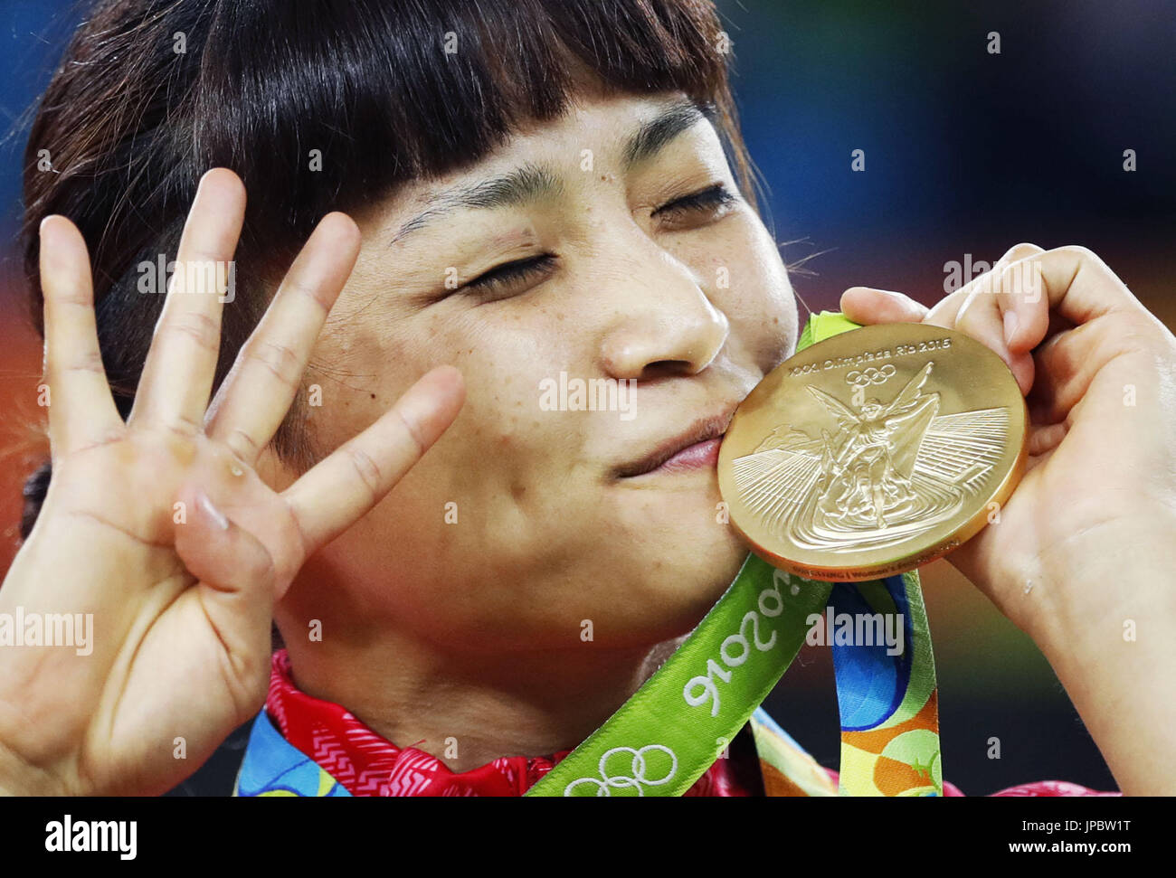 File photo shows Kaori Icho kissing a gold medal after winning the ...