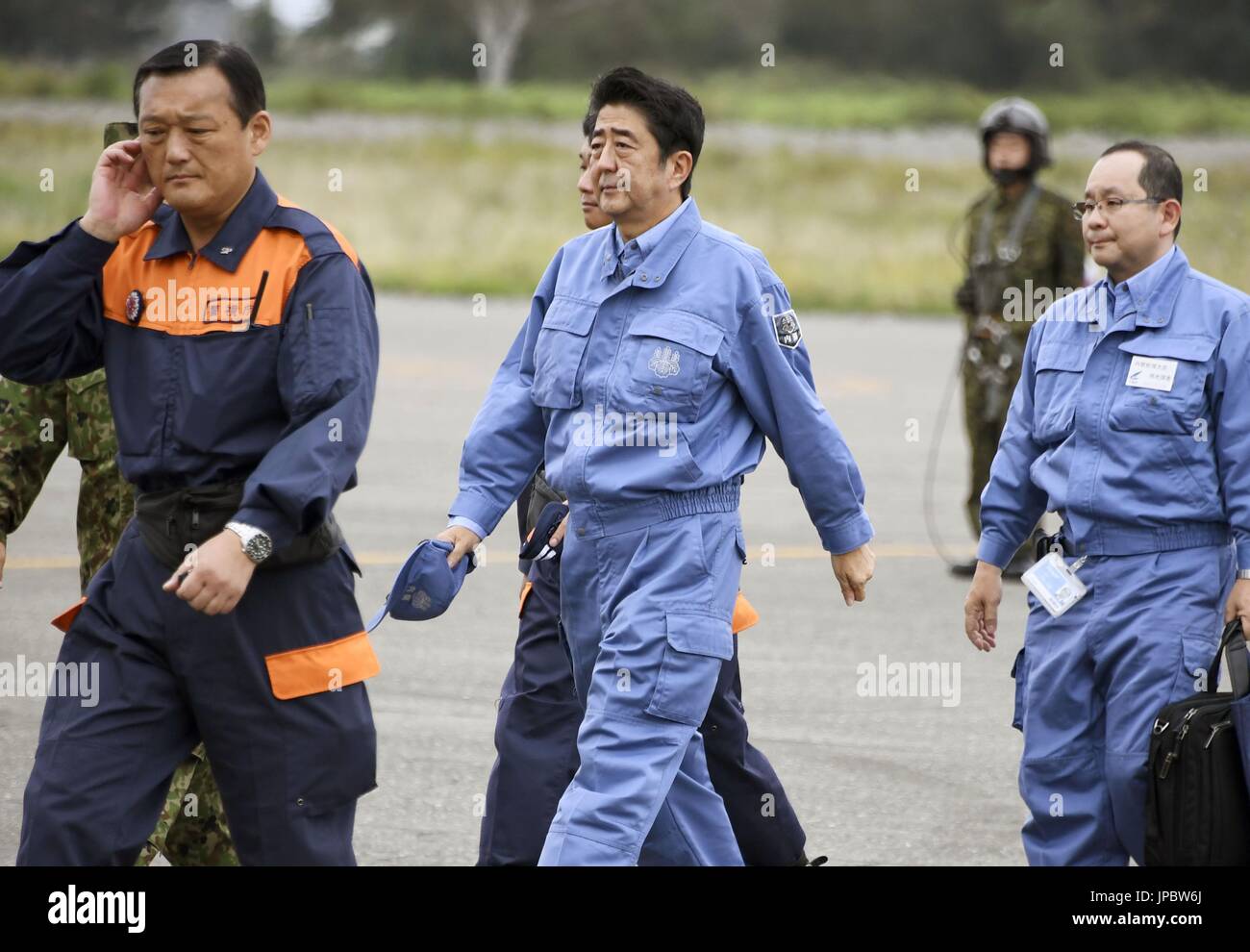 Japanese Prime Minister Shinzo Abe (C) arrives at a Ground Self-Defense ...