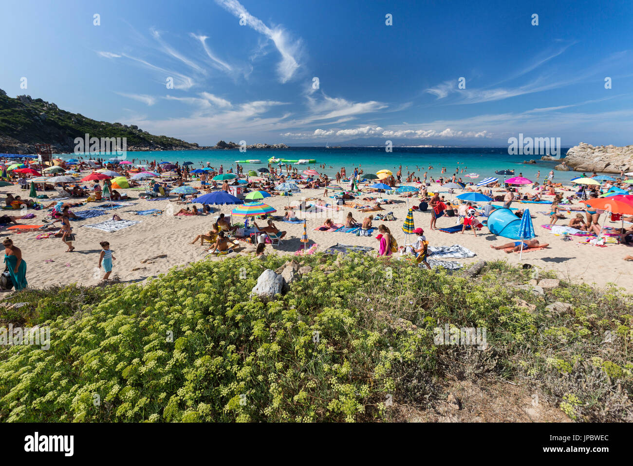 Tourists on the beach of fine sand surrounded by turquoise sea Santa ...