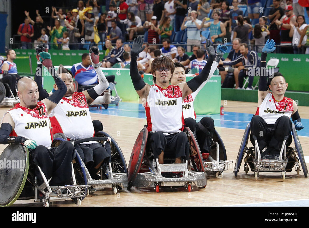 Players of the Japanese wheelchair rugby team celebrate after defeating ...