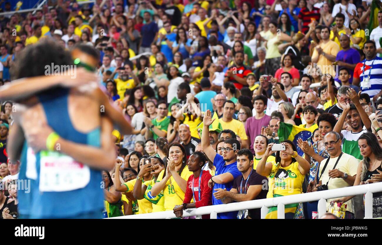 Spectators applaud as Brazilian runners hug after finishing the men's ...