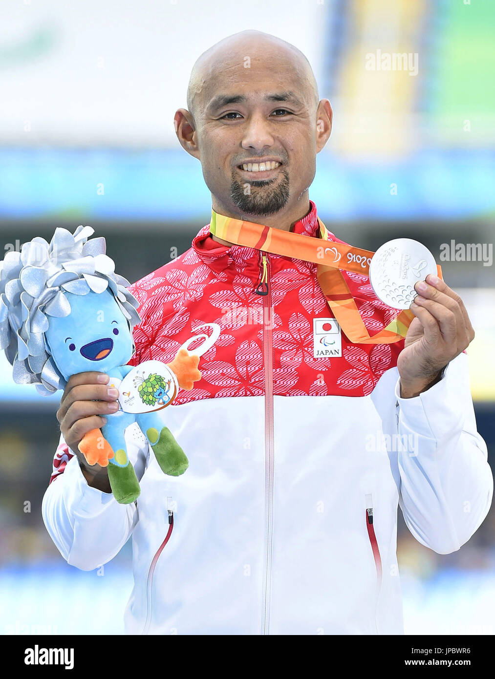 Atsushi Yamamoto of Japan poses with his silver medal in the men's T42 ...