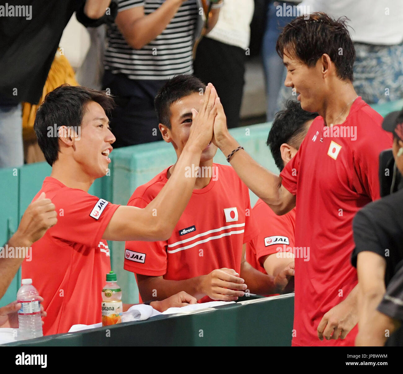 Japan's Kei Nishikori (L) celebrates with his teammate Yoshihito ...