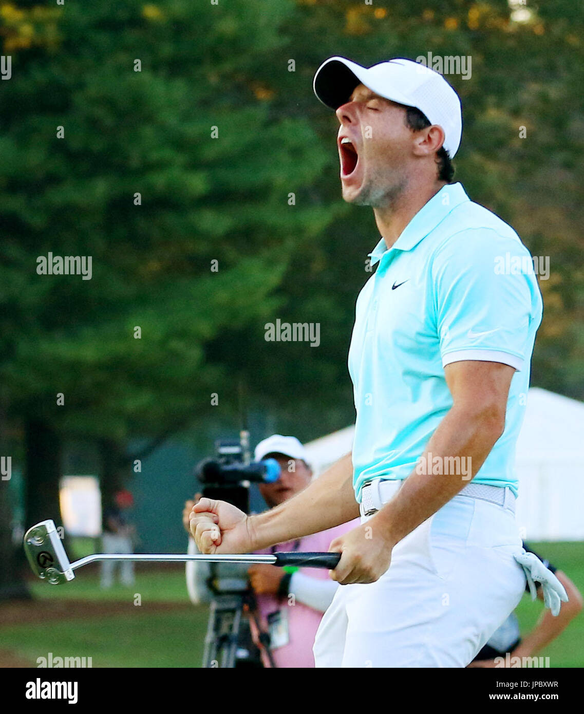Rory McIlroy of Northern Ireland reacts after winning a three-way ...