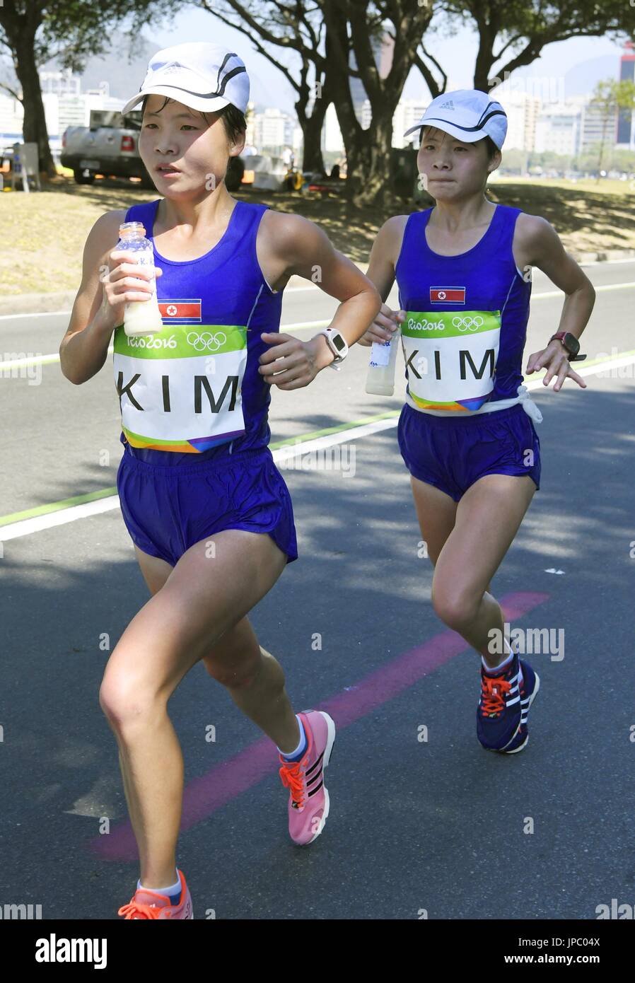 North Korean twins Kim Hye Song (L) and Kim Hye Gyong run in the women ...