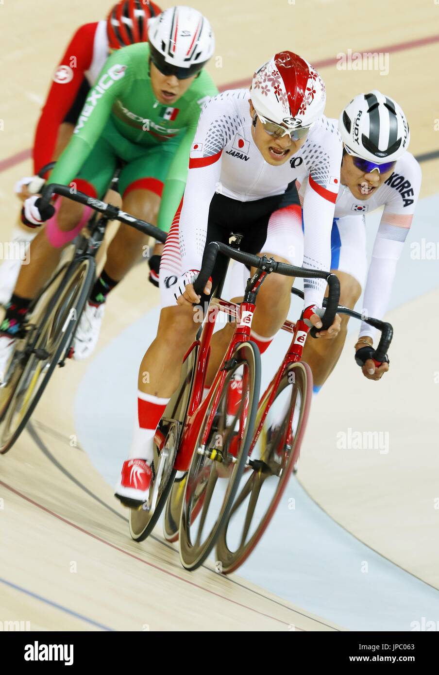 Japanese cyclist Kazushige Kuboki (2nd from R) competes in a men's ...
