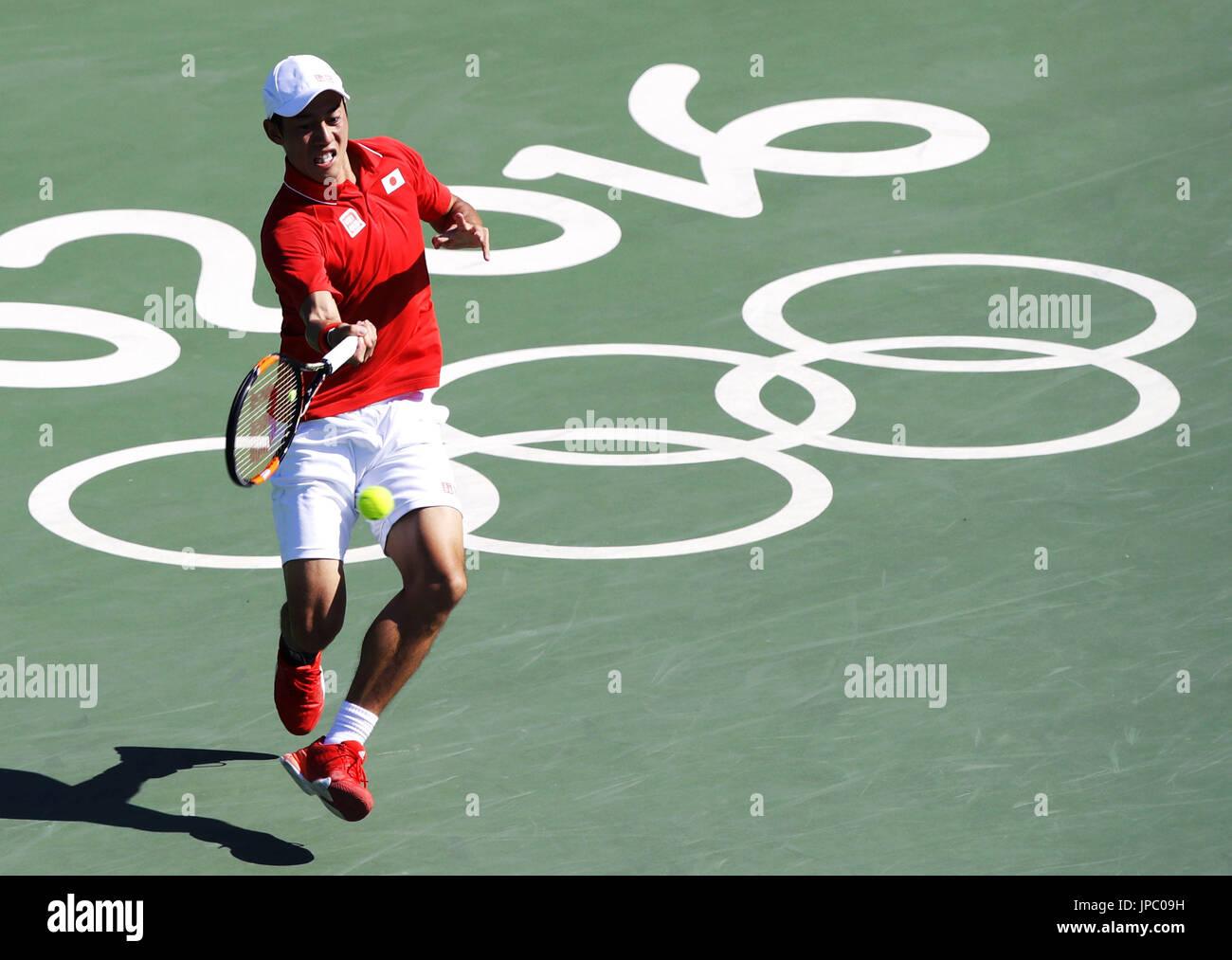 Kei Nishikori of Japan plays a forehand during his bronze-medal match ...