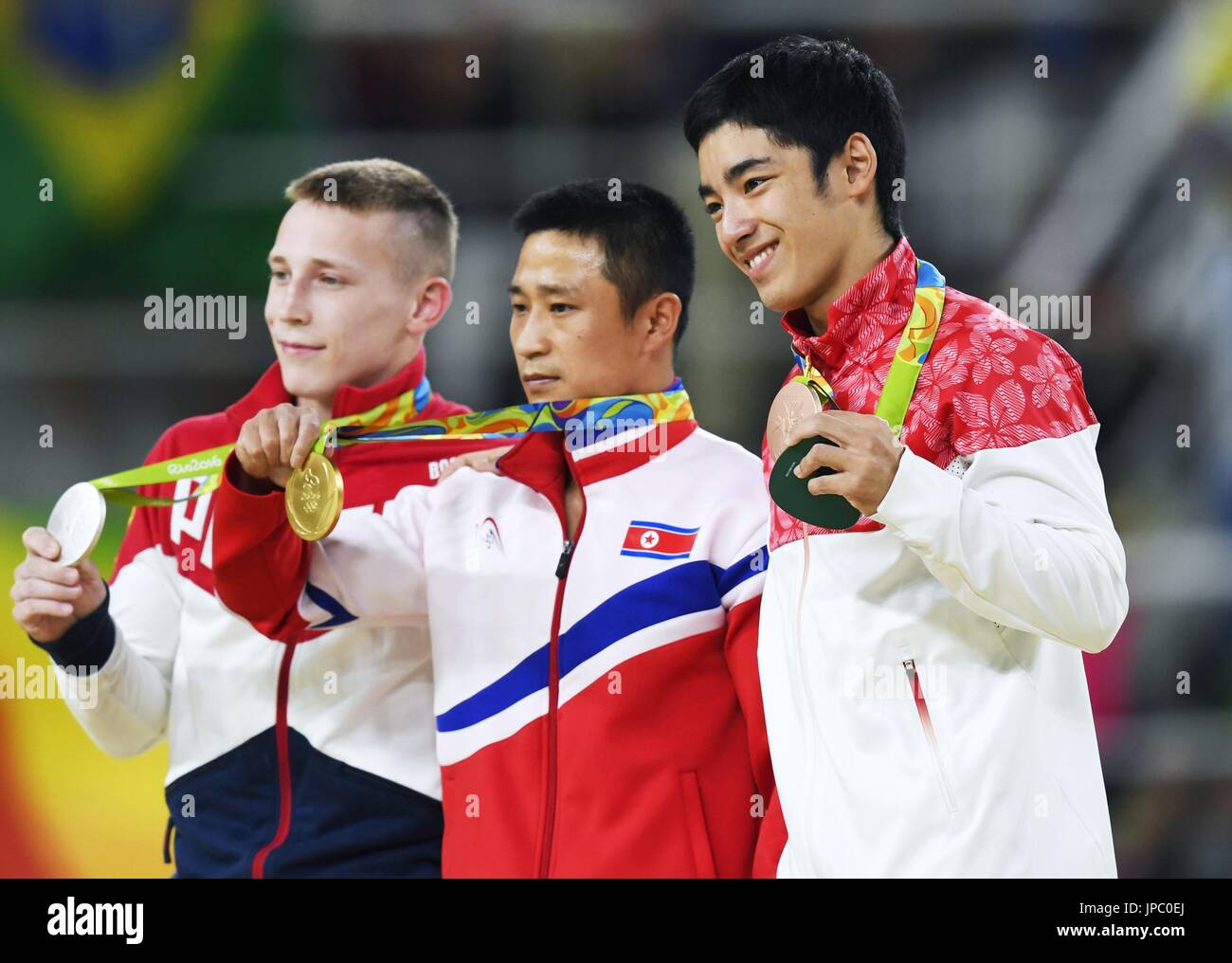 The men's vault gold medalist Ri Se Gwang (C) of North Korea, silver ...