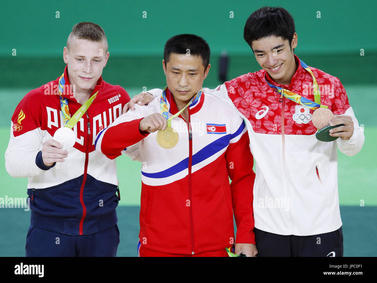 The men's vault gold medalist Ri Se Gwang (C) of North Korea, silver ...