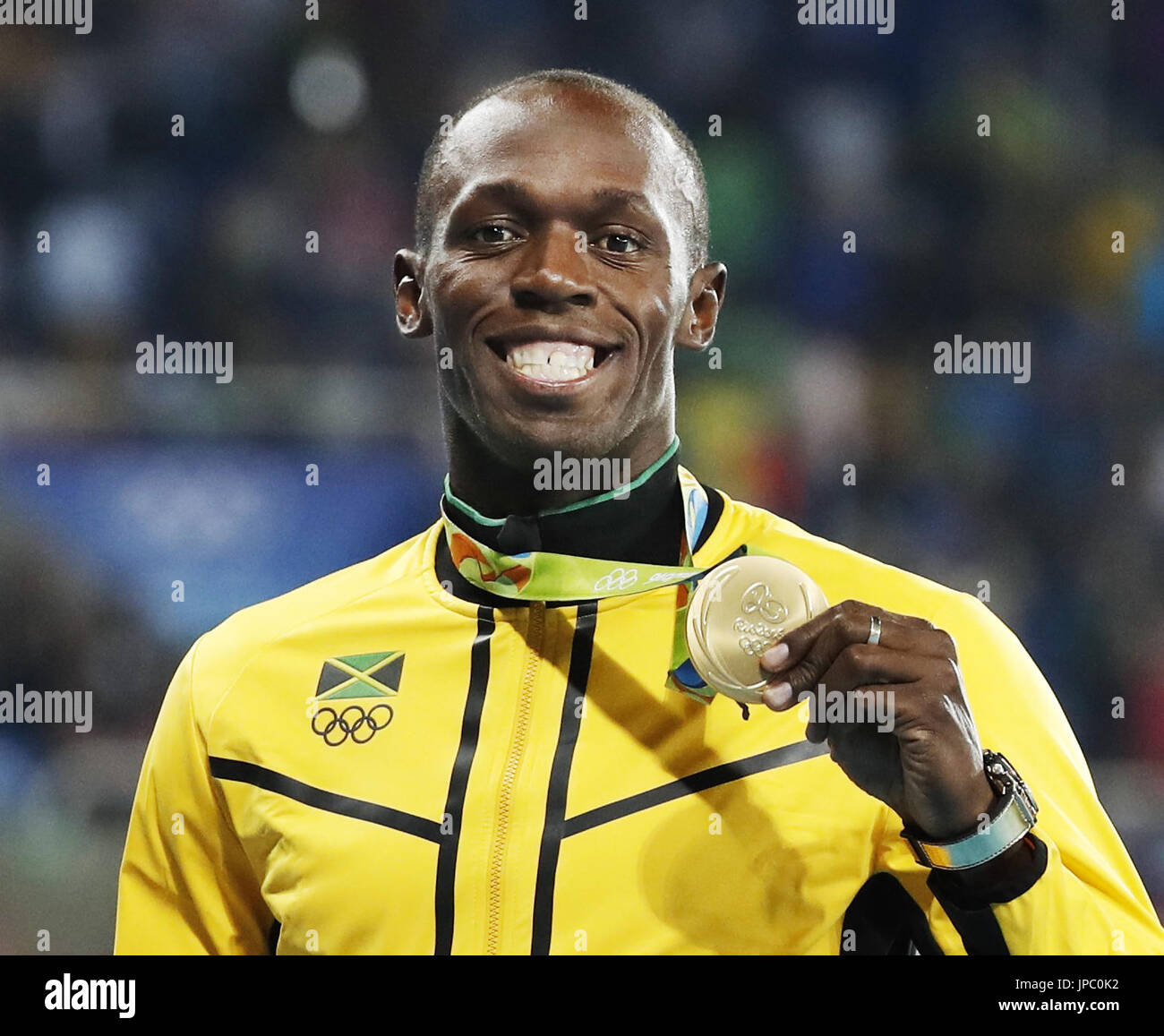 Usain Bolt of Jamaica shows off his gold medal at the Rio de Janeiro ...