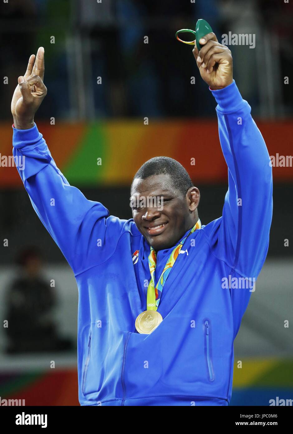 Cuban wrestler Mijain Lopez celebrates at the medal ceremony for the ...