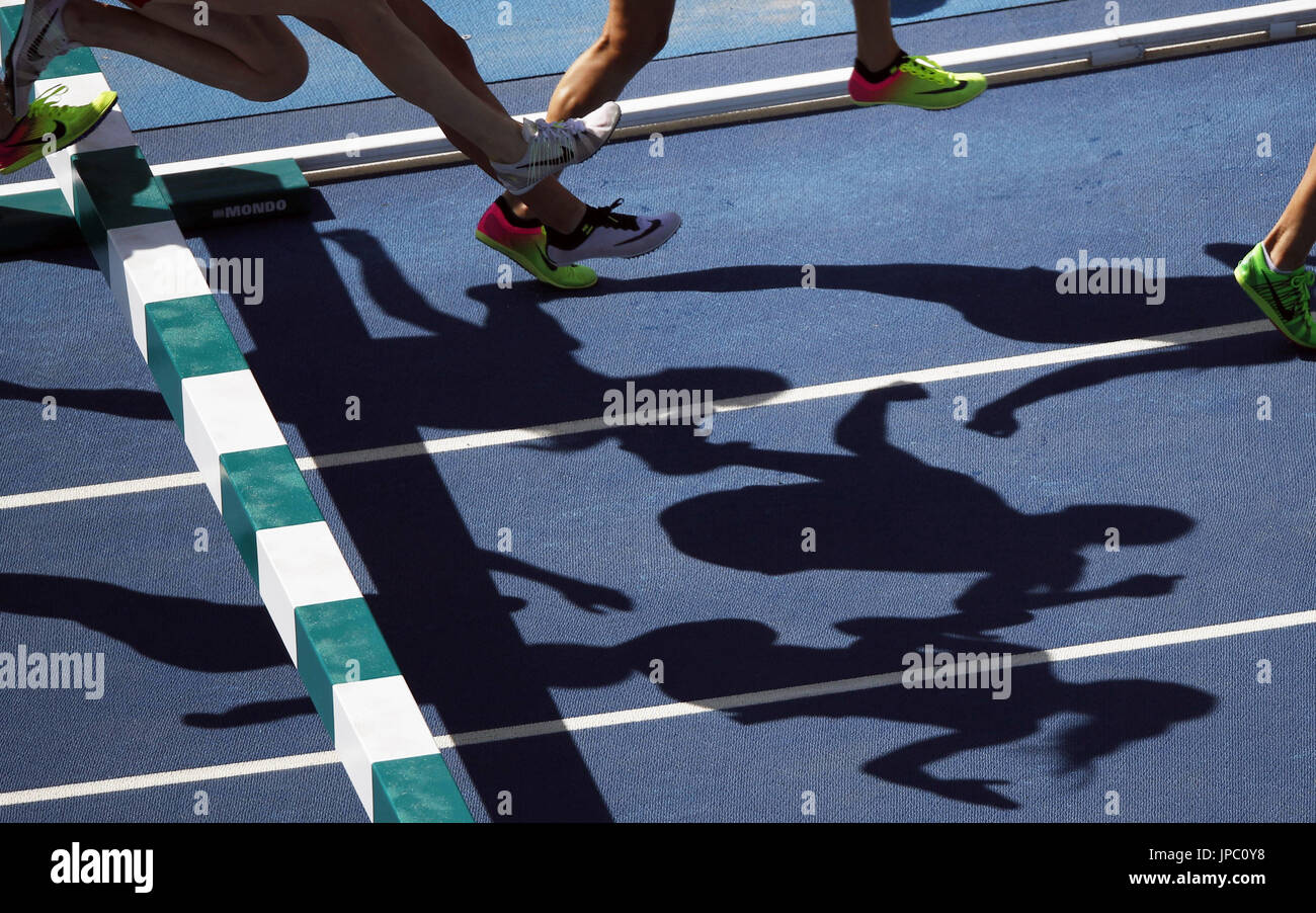 Photo shows shadows of jumping runners in the women's 3,000-meter ...