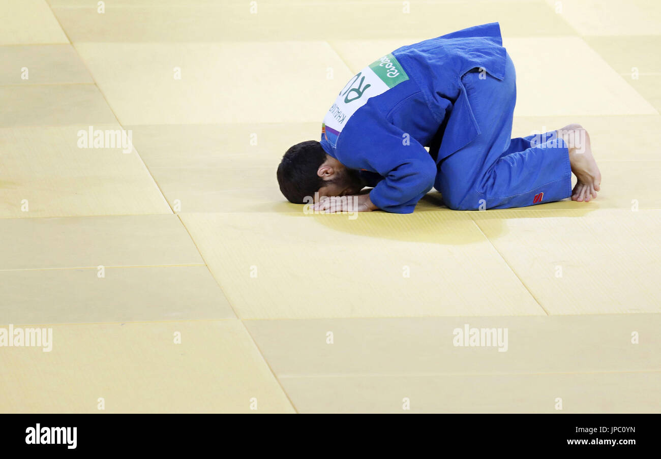 Russian judoka Khasan Khalmurzaev bows on the tatami mat after winning ...