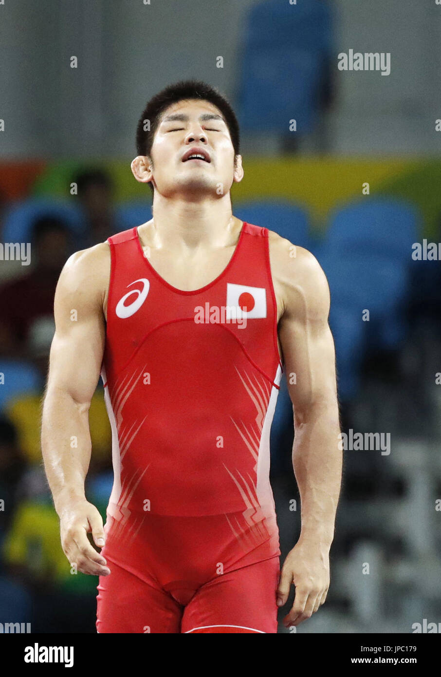 Japan's Tomohiro Inoue reacts after being defeated by Shmagi Bolkvadze of Georgia in a bronze ...