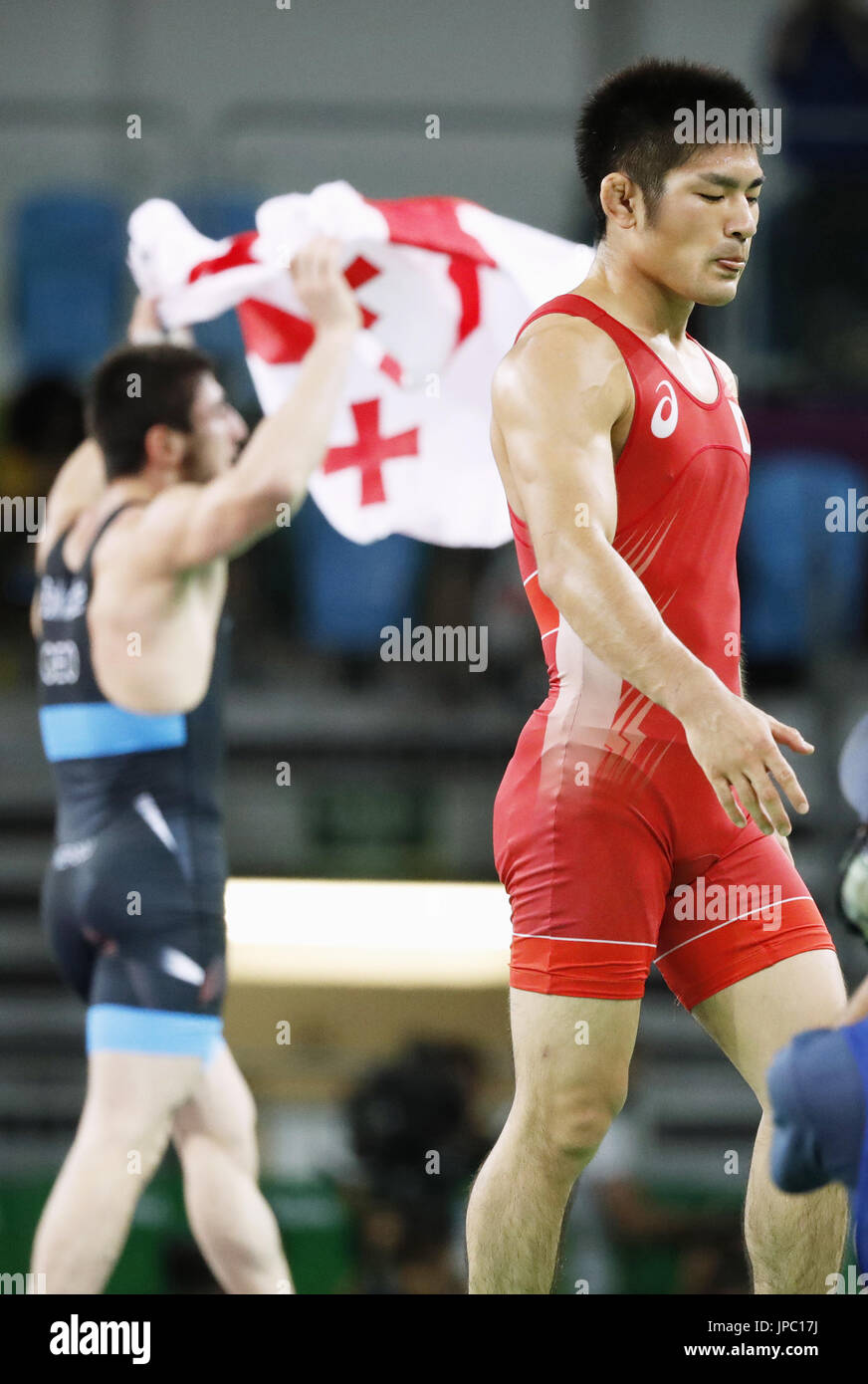 Japanese wrestler Tomohiro Inoue (R) reacts as Shmagi Bolkvadze of ...