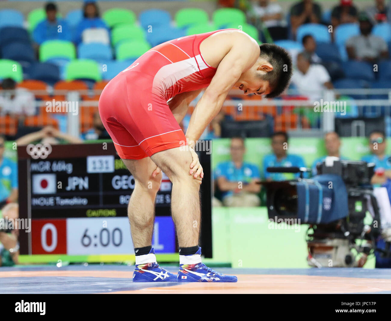 Japan's Tomohiro Inoue reacts after being defeated by Shmagi Bolkvadze of Georgia in a bronze ...