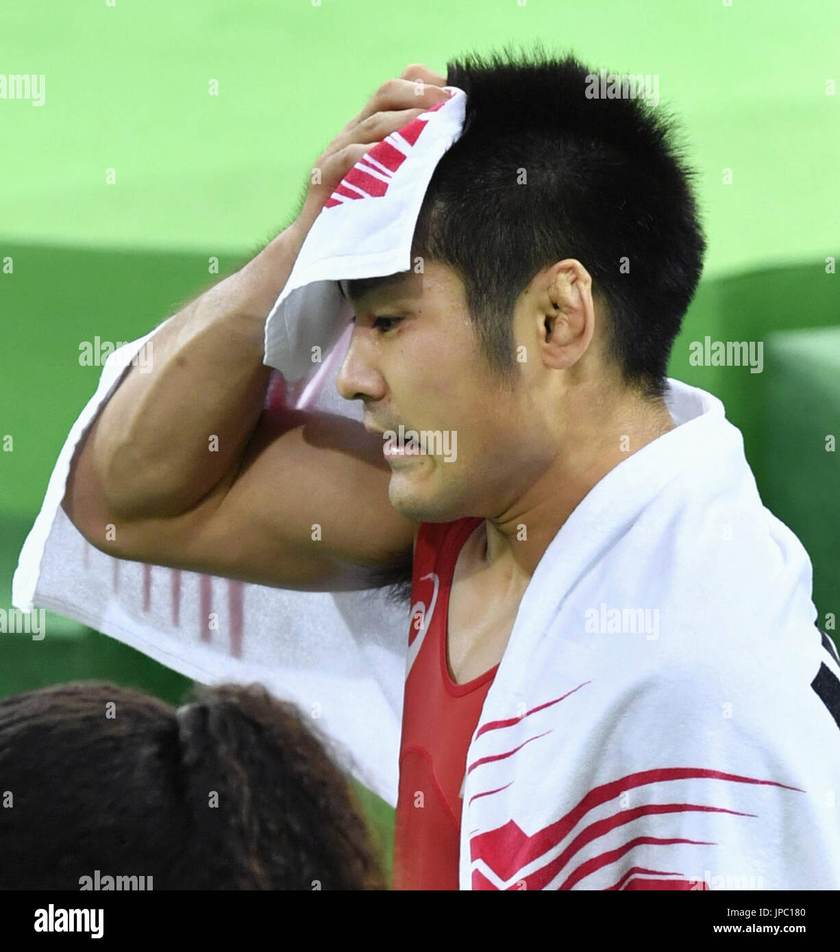 Japanese wrestler Tomohiro Inoue walks off the mat after losing to Shmagi Bolkvadze of Georgia ...