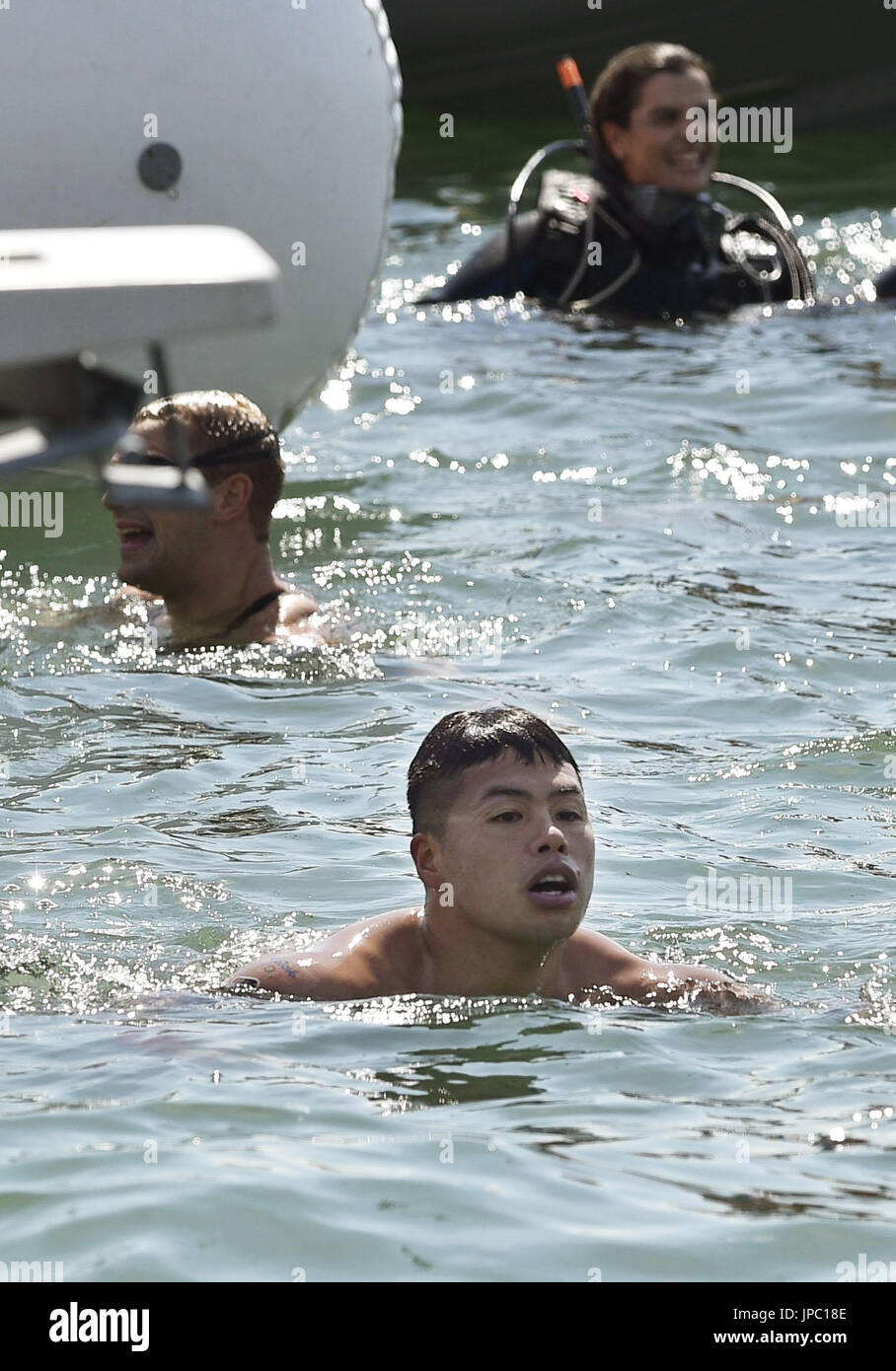 Japan's Yasunari Hirai (front) is seen after finishing the men's 10 ...