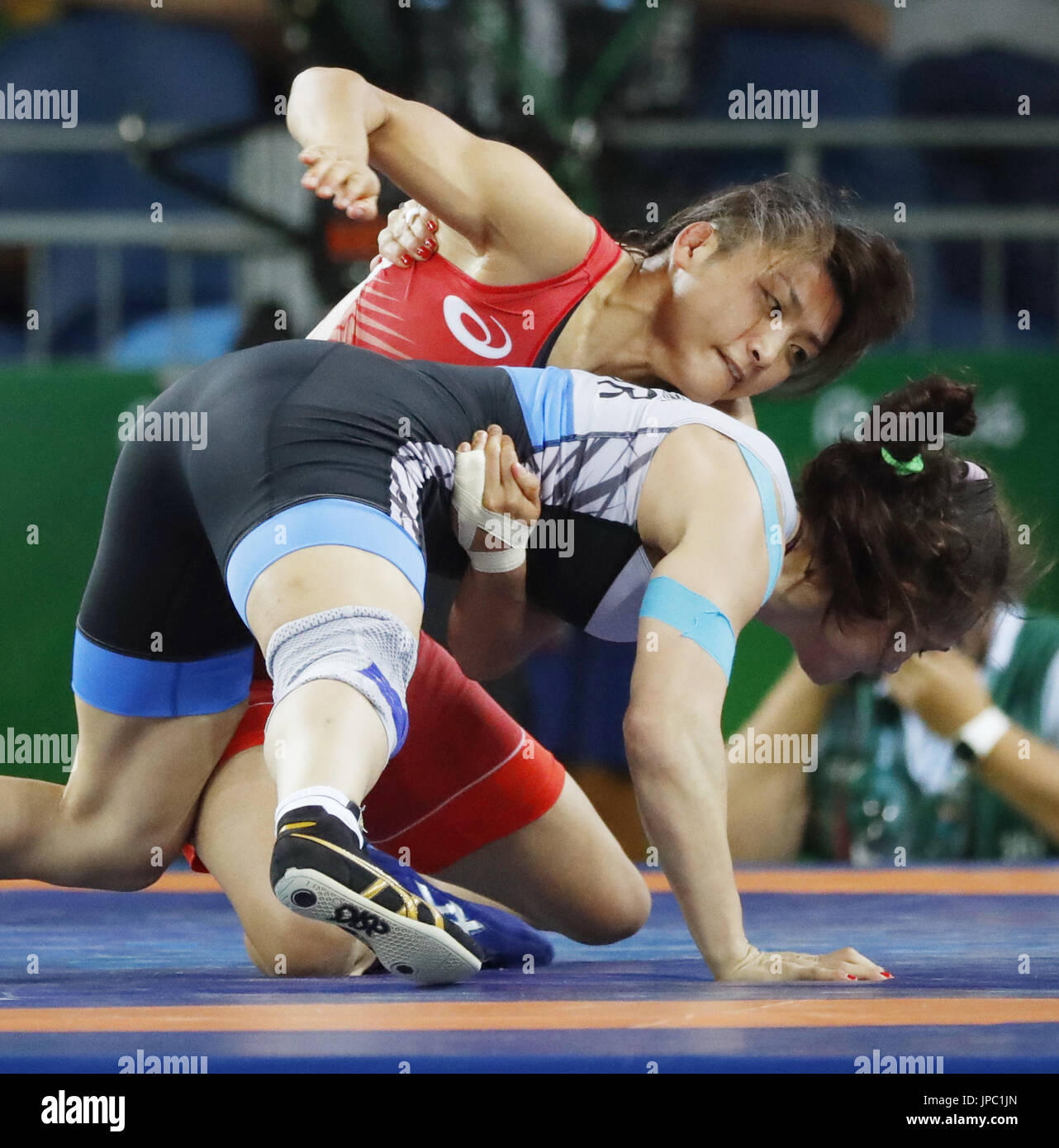 Japan's Kaori Icho (back) faces off against Elif Jale Yesilirmak of Turkey during a women's ...