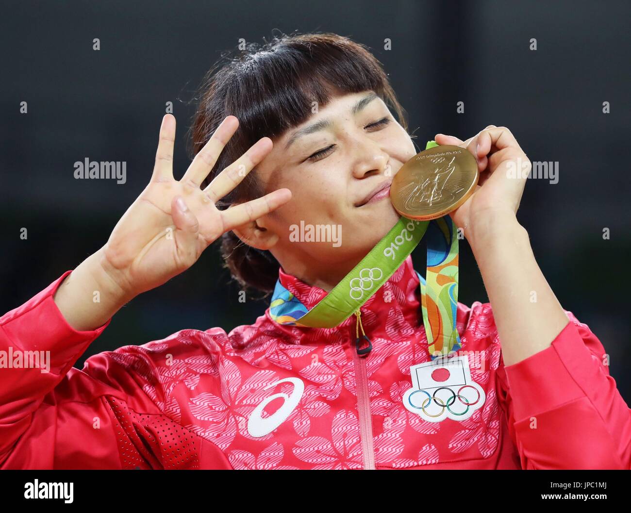 Japan's Kaori Icho kisses her gold medal during the award ceremony for ...