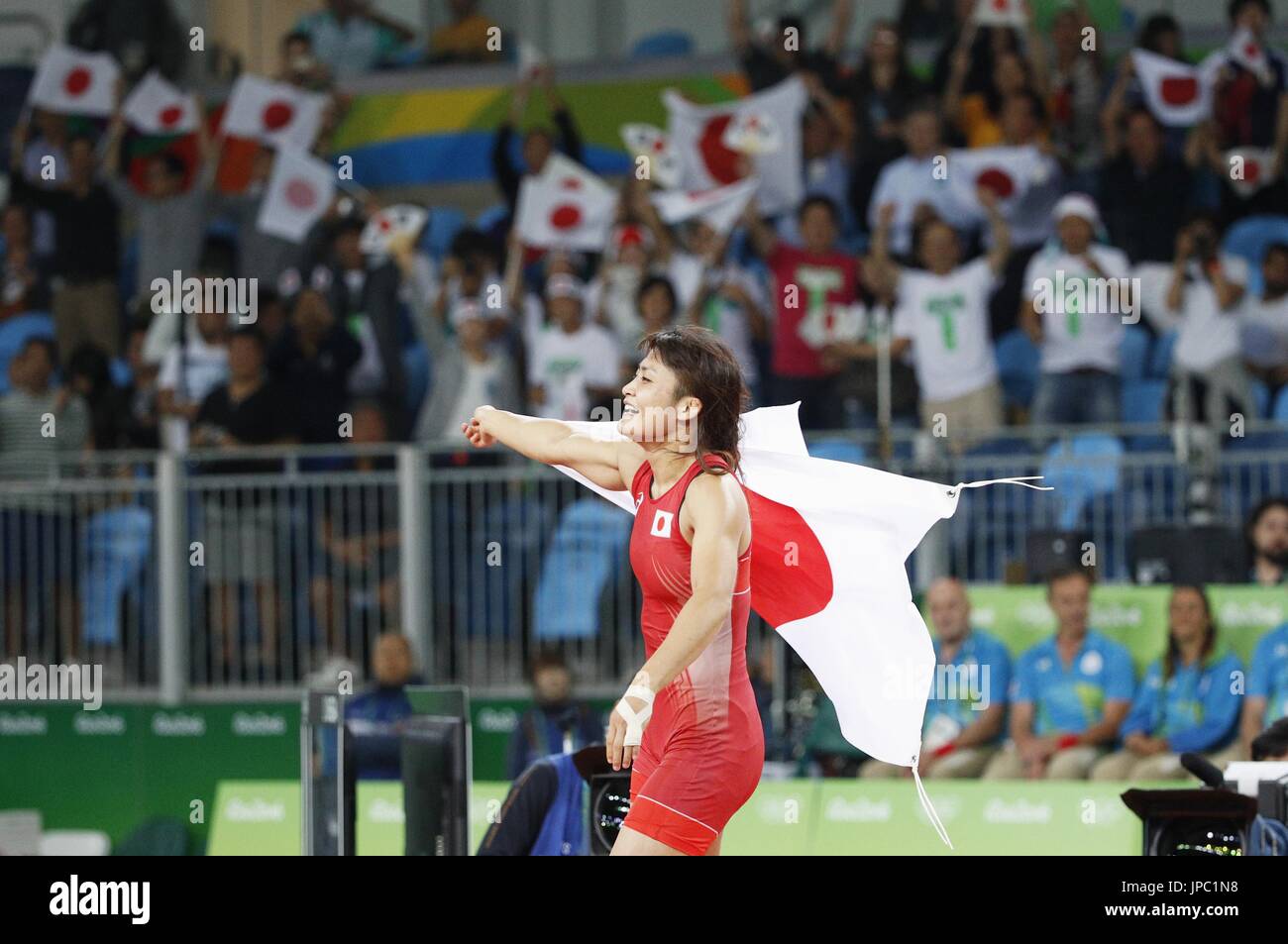 Japan's Kaori Icho celebrates with her country's national flag after ...